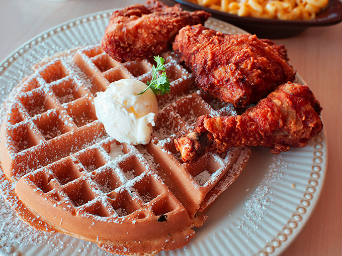 The chicken and waffle plate at Dinah's performs the perfect culinary ballet—crispy, savory chicken dancing gracefully with a sweet, pillowy waffle partner.
