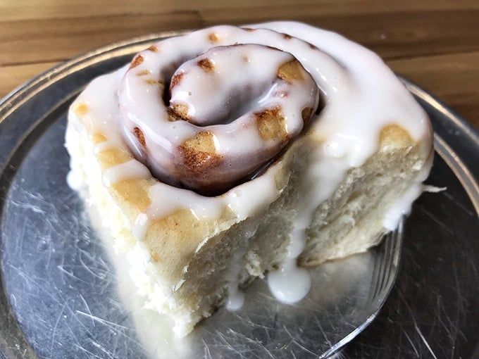 The money shot – pillowy dough, cinnamon swirls, and that glorious icing that makes you temporarily forget about concepts like "moderation" and "sharing."