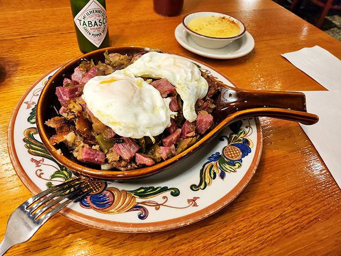Corned beef hash crowned with perfectly poached eggs—the breakfast equivalent of finding front-row concert tickets in your coat pocket.
