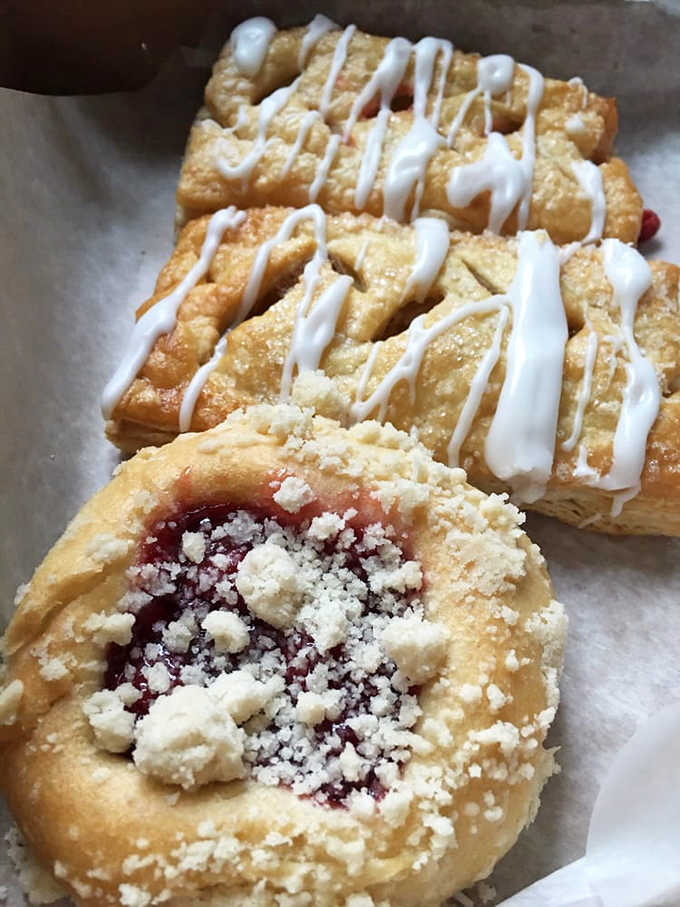 These pastries have the kind of flaky, buttery layers that make French bakeries nervous. The fruit filling peeks out like it's playing a delicious game of hide-and-seek.