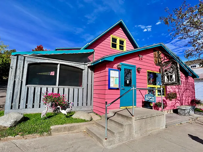 This vibrant pink building isn't just eye-catching—it's a promise of the equally colorful characters and conversations waiting inside.