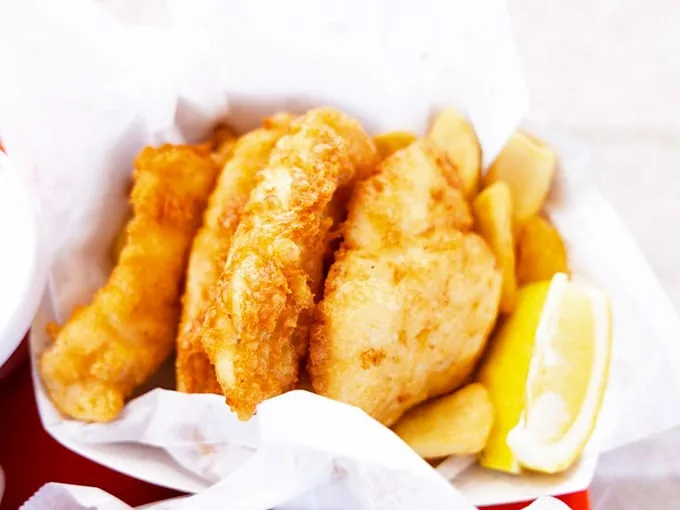 The fish and chips that launched a thousand return trips. Crispy, golden batter protecting flaky white fish—a combination that's caused more joy than should be legal.