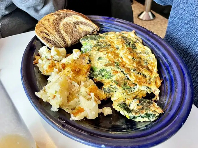 This Florentine omelet doesn't need a passport to transport you to flavor paradise. Those home fries deserve their own fan club.