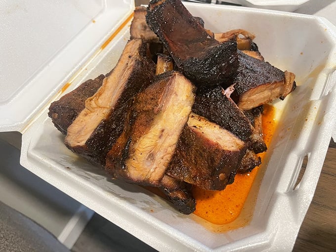 These ribs aren't falling off the bone—they're respectfully maintaining their structural integrity until that perfect first bite.