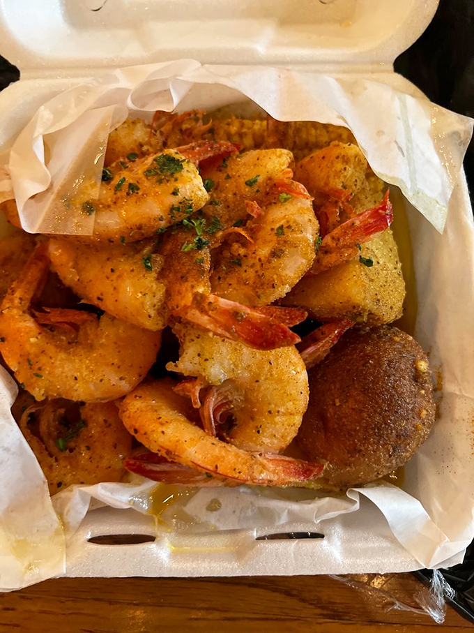 Garlic shrimp that demands the "seafood hunch" – that posture of pure focus where nothing exists except you and your meal.