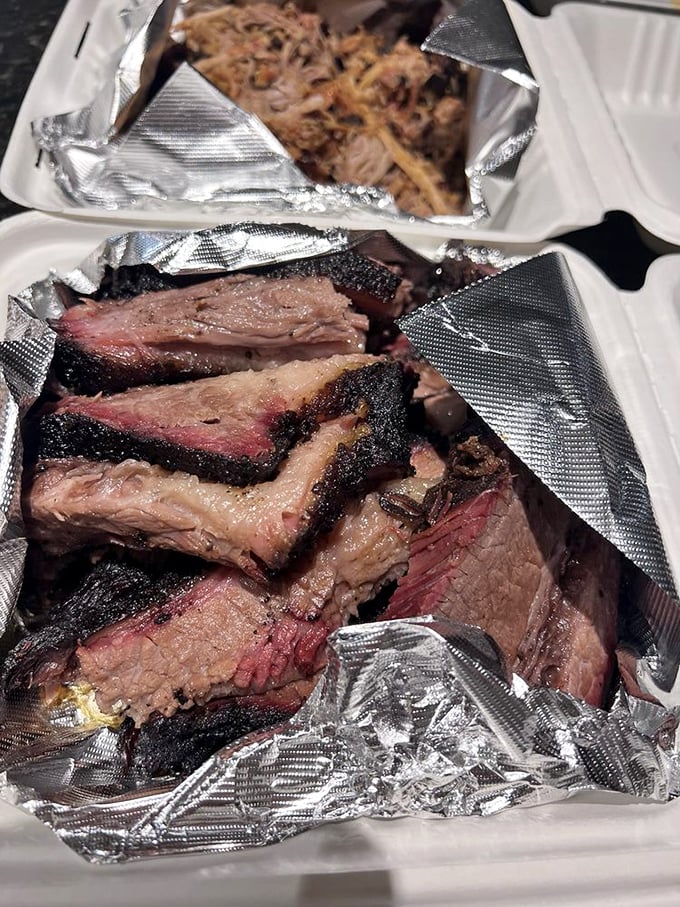 The cross-section tells the whole story: perfectly rendered fat, pink smoke ring, and meat so tender it practically surrenders.