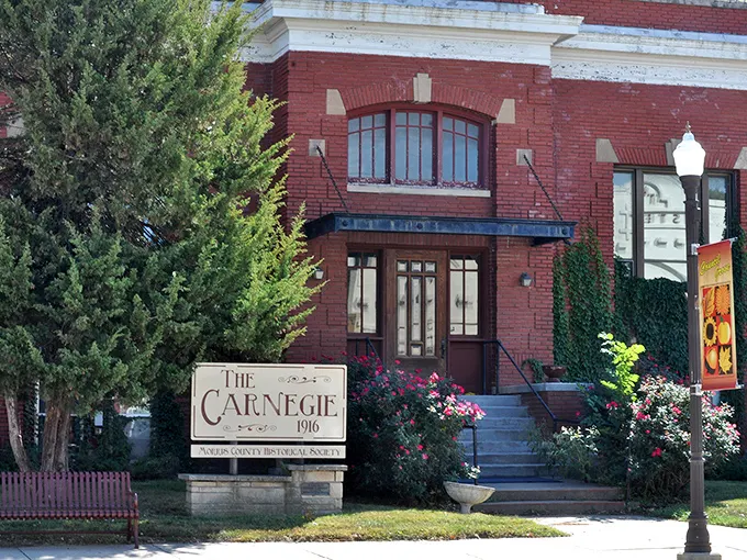 The Carnegie building now houses local history instead of books, proving some architectural glow-ups age like fine wine.