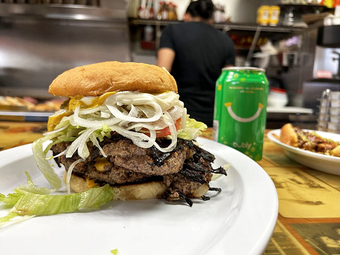 Behold the architectural marvel that is Sid's onion burger—layers of beef, cheese, and those signature onions that have become one with the patty.