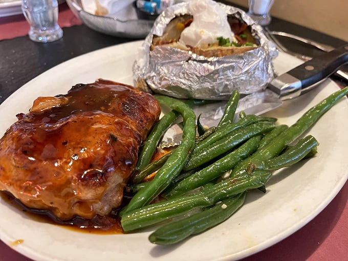 Bourbon-glazed pork that makes you want to write poetry alongside green beans that somehow make vegetable consumption feel indulgent. That's talent.