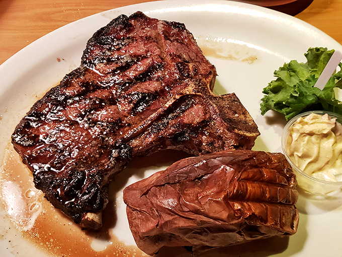 This ribeye doesn't just have grill marks—it has autographed the plate with its juices like a celebrity leaving its signature.