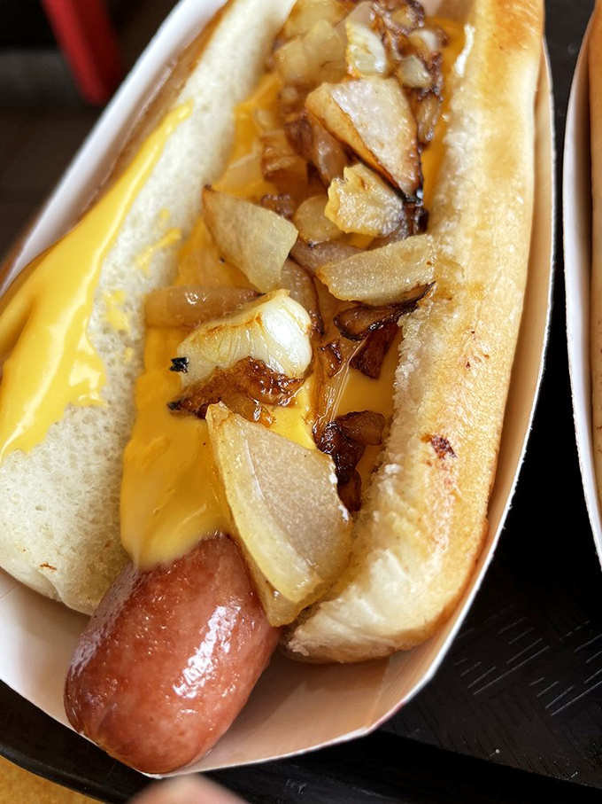 The South Philly Dog comes dressed to impress with melted cheese and caramelized onions – a Pennsylvania romance on a bun.