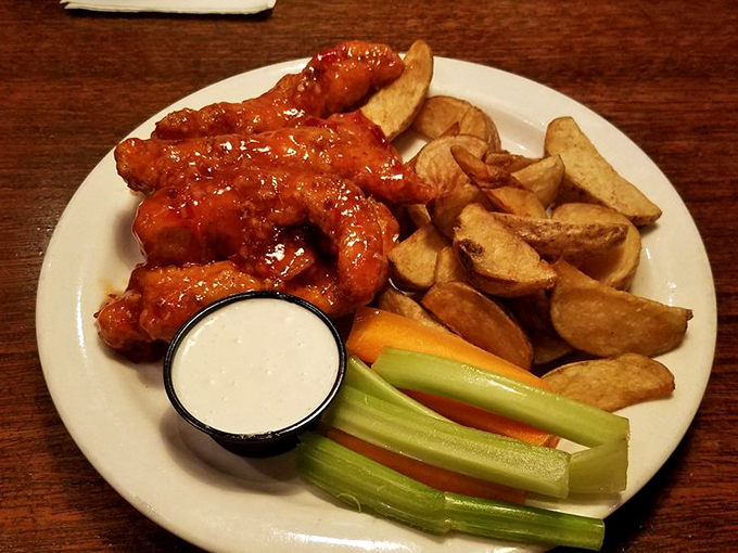 These Buffalo Tenders deserve a national holiday – crispy, saucy, and served with cooling ranch and potato wedges that George Washington would've crossed the Delaware for.