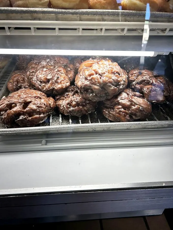 The holy grail of fritters, glistening with glaze and waiting to change your definition of what breakfast can be.
