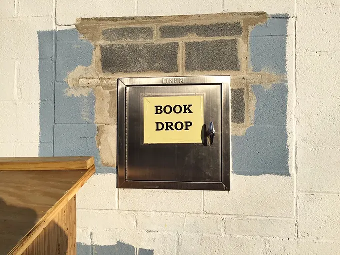 The humble "Book Drop" – gateway for donations that fuel this literary ecosystem. One reader's discard becomes another's discovery.