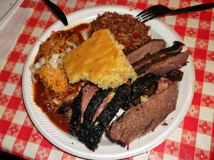 Smoky chicken, baked beans, golden cornbread, and sweet corn—a plate that wouldn't be out of place at a Southern family reunion, somehow teleported to New Hampshire.