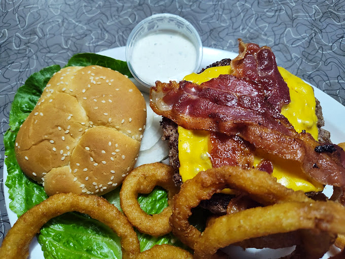 The bacon cheeseburger that launched a thousand cravings – crispy, melty, and substantial enough to require both hands and several napkins.