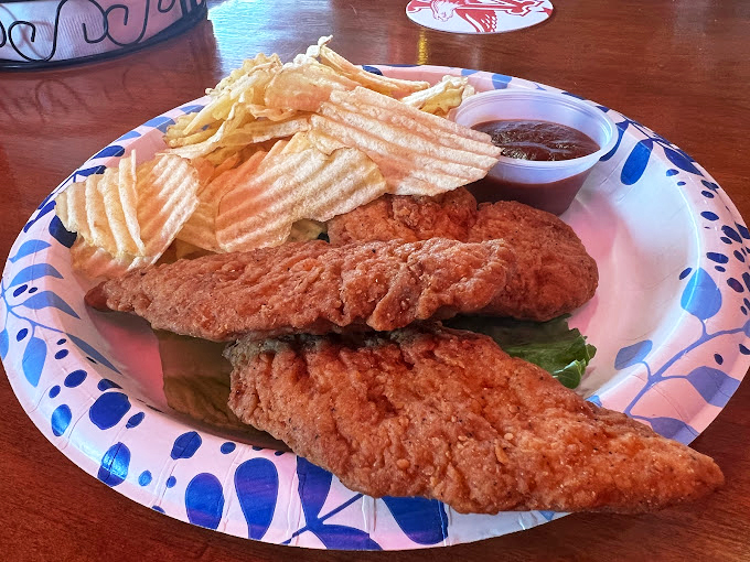 Chicken strips that could make a vegetarian weep with temptation, served with chips that achieve that mythical balance of crisp exterior and fluffy interior.