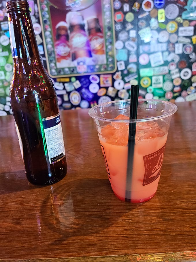 That vibrant orange cocktail isn't just a pretty face – it's a burst of flavor waiting to make your gaming adventure even more colorful.