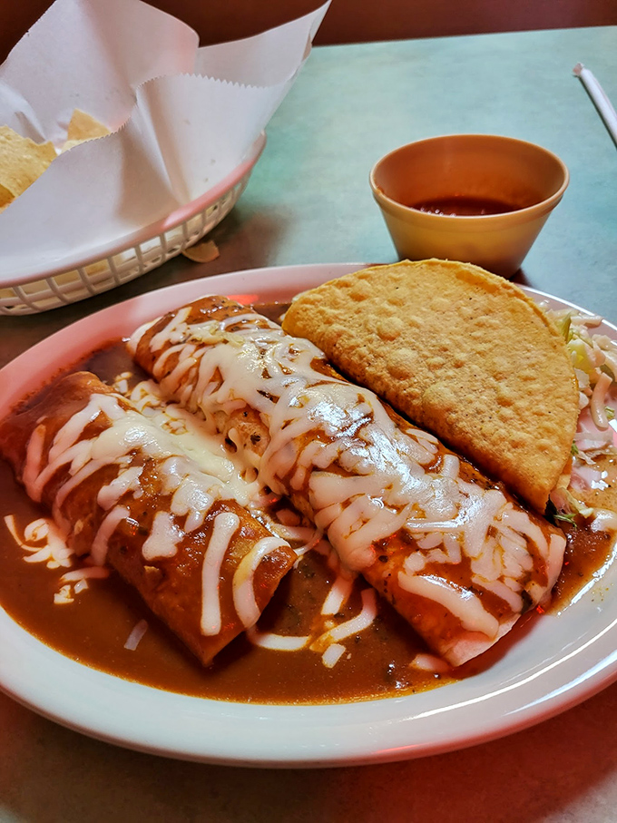 The perfect relationship doesn't exi— Oh wait, it does: enchiladas and tacos sharing a plate like they were meant to be together.