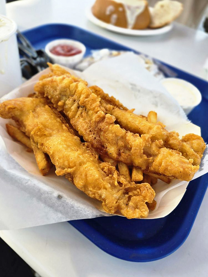 These golden fish fillets aren't just fried—they're transformed into crispy vessels of oceanic delight that would make Neptune himself jealous.