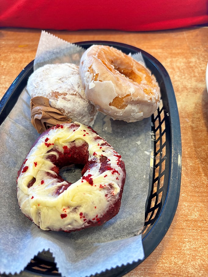 Red velvet, glazed, and powdered companions waiting for their coffee soulmates. Some relationships are just meant to be.