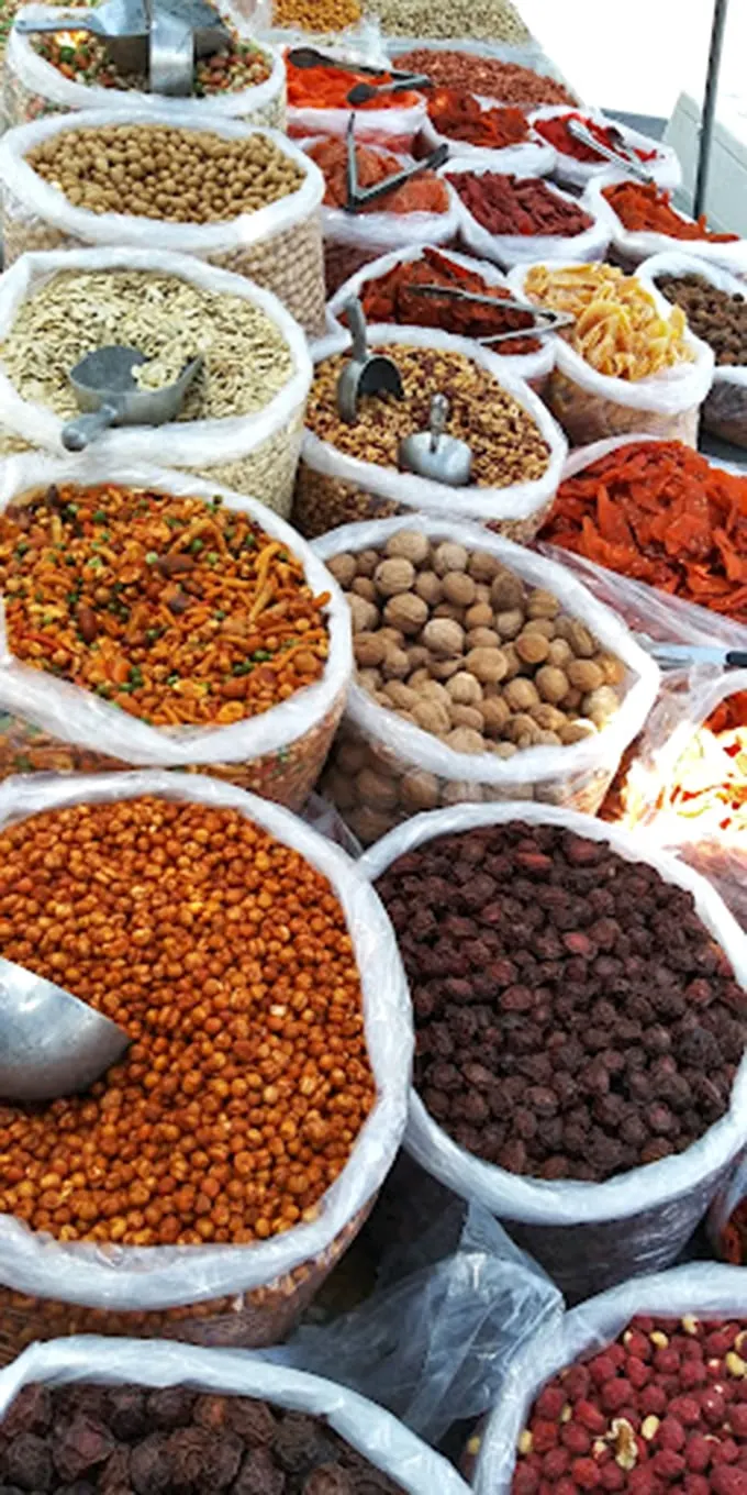 A spice lover's dream landscape. These colorful mountains of nuts, spices, and dried goods could make even the blandest kitchen come alive.