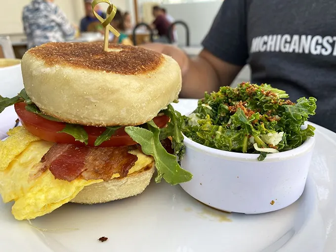 The breakfast sandwich here makes other sandwiches look like they're not even trying—a perfect marriage of English muffin, egg, bacon, and greens that deserves its own thank-you note.