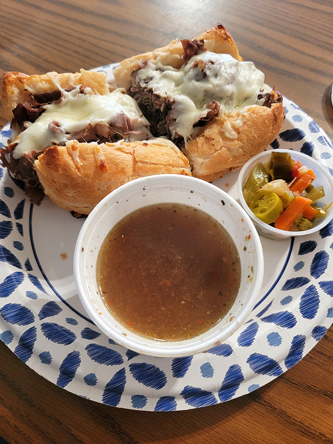 The proper Italian beef requires strategic eating posture. Lean forward, elbows on table, surrender to the inevitable mess—it's worth every napkin.
