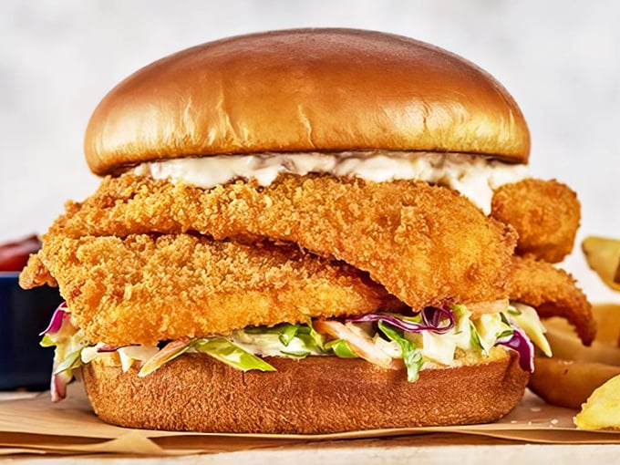 Behold the architectural marvel that is Dockside's flounder sandwich—golden-fried perfection stacked so high it deserves its own zip code.