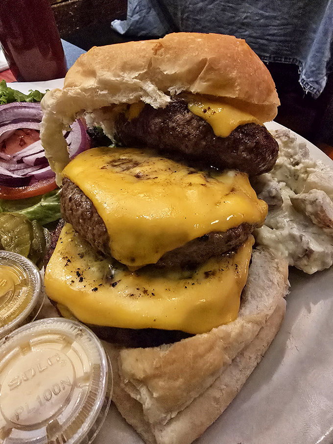 Behold the skyscraper of satisfaction! This towering burger defies both gravity and the notion that more is too much