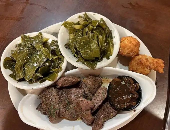 Venison medallions and collard greens – the Florida backwoods on a plate. This isn't your uncle's tough deer meat; it's wilderness transformed into tenderness.