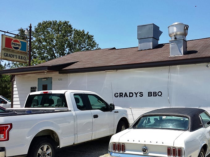 This white clapboard building might look plain, but inside waits wood-fired alchemy that transforms pork into pure gold.