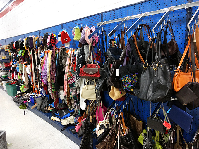 Handbag heaven! Designer labels mingle democratically with everyday brands, all hanging in suspended animation waiting for their second act.