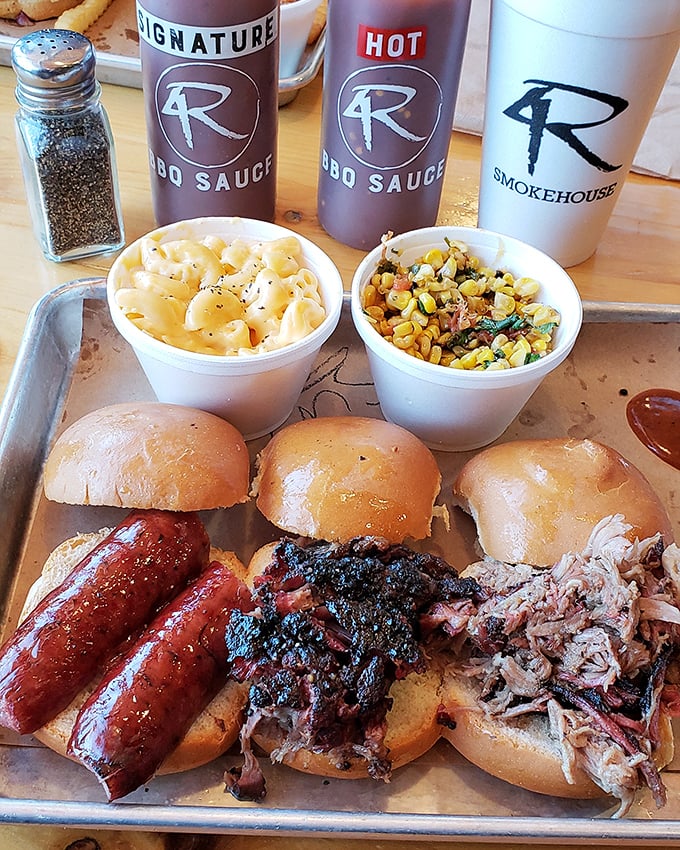 The barbecue trinity: sausage, brisket, and pulled pork, served with sides that aren't afterthoughts but co-stars in this meaty blockbuster.