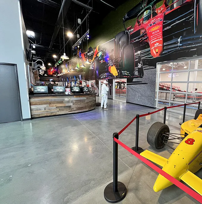 The reception area showcases racing memorabilia that reminds you this isn't just play—it's a proper motorsport with history and heroes.