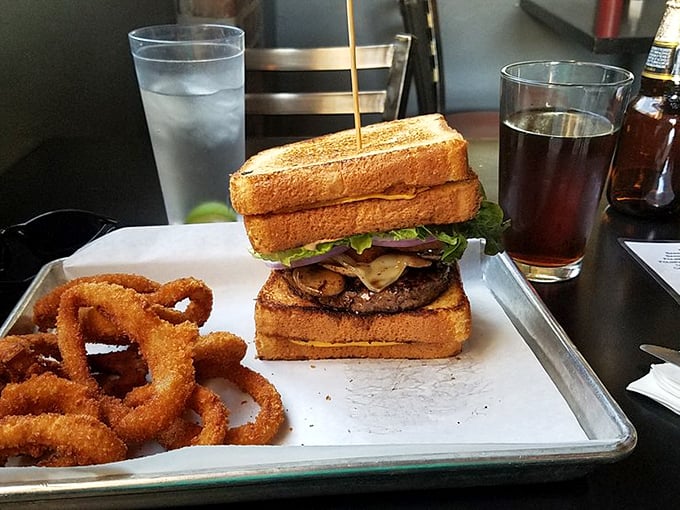 Even Lindy's "simpler" offerings demand respect. This Texas toast burger with onion rings proves sometimes the best relationships are built on bread.