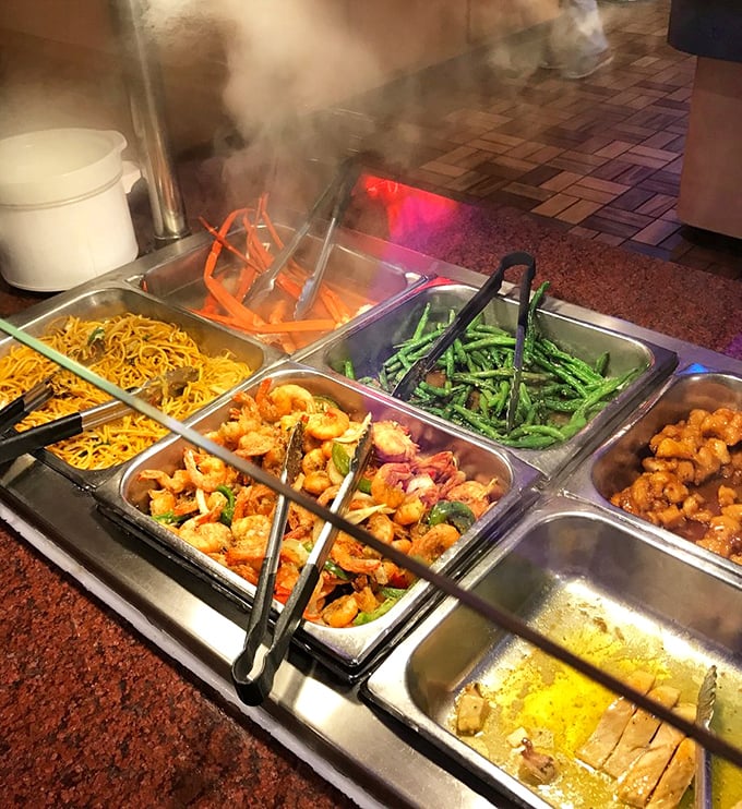 The steam rising from these dishes isn't just vapor—it's an aromatic invitation to pile your plate higher than your common sense suggests.