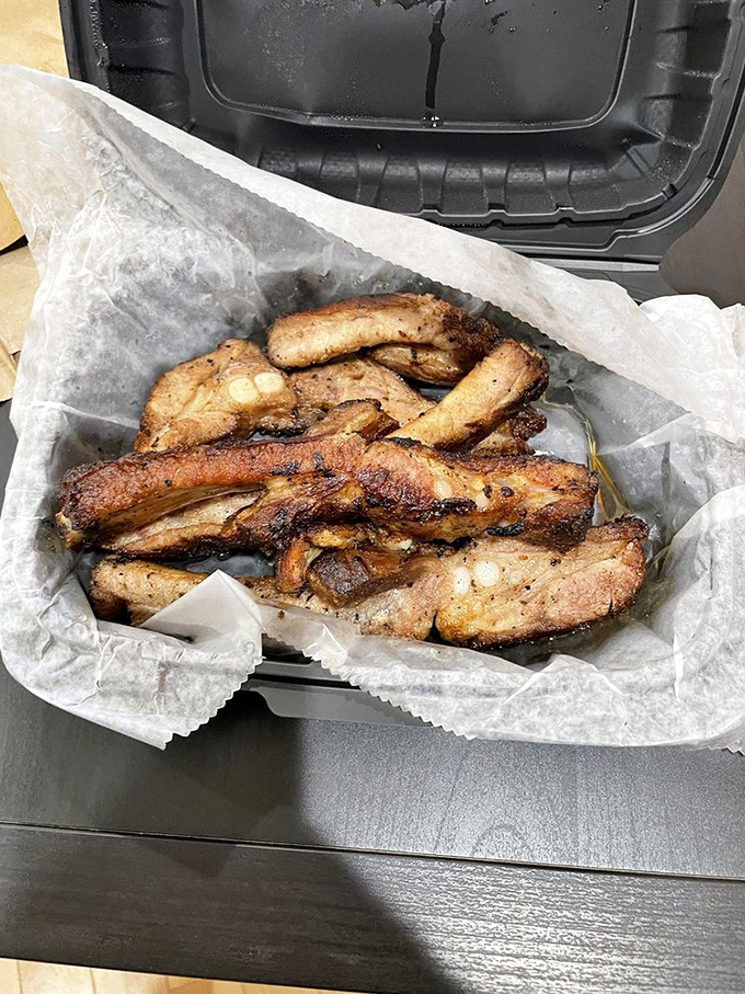 These ribs don't need a fancy introduction—they speak the universal language of perfectly rendered fat and smoke-kissed meat.