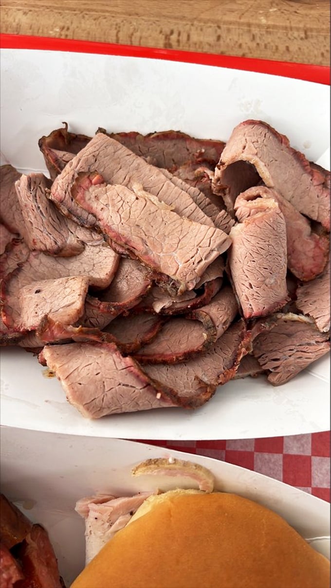 Brisket sliced thicker than a good novel, with edges kissed by smoke. This isn't just meat—it's a time capsule of patience and wood-fired perfection.