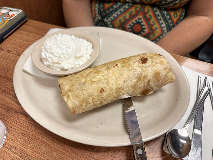 The breakfast burrito—mankind's greatest contribution to portable morning meals. A tortilla torpedo of satisfaction with a side of pure, unadulterated joy.