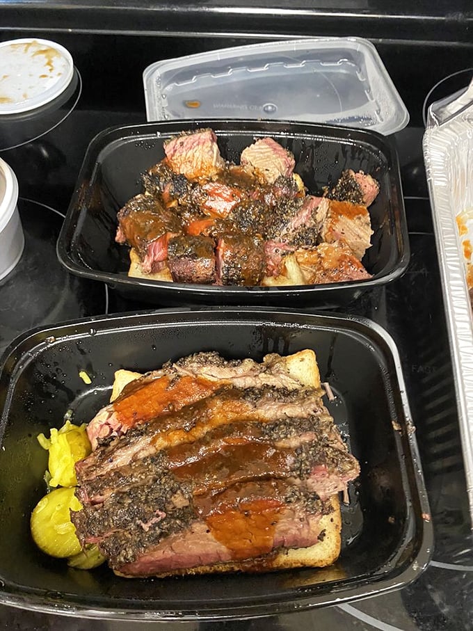 Behold the holy trinity of BBQ—brisket with that perfect smoke ring, burnt ends with caramelized edges, and pickles for that acidic counterpoint.