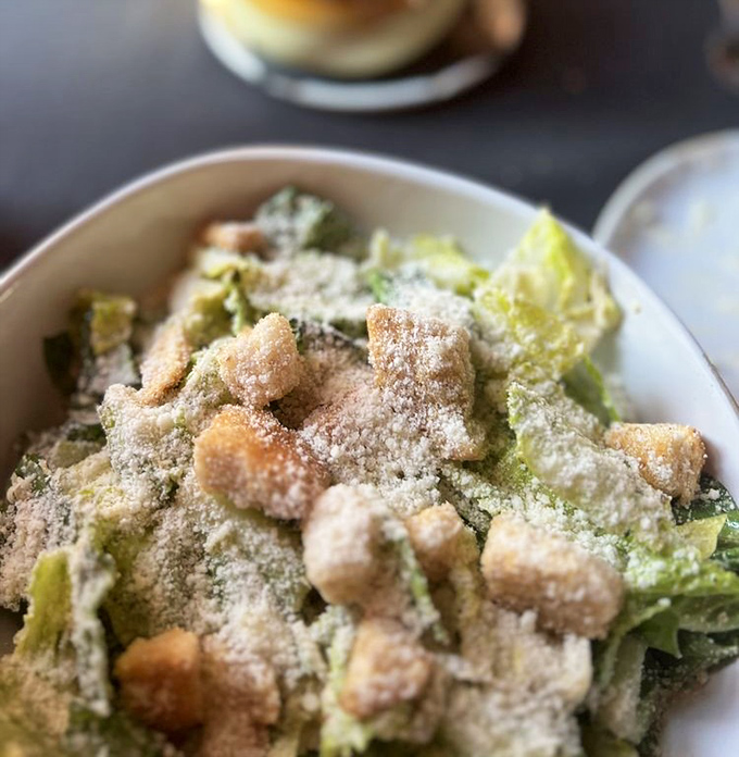 A proper Caesar salad that Julius himself would approve of—crisp romaine, generous parmesan, and croutons that crunch like they mean it.