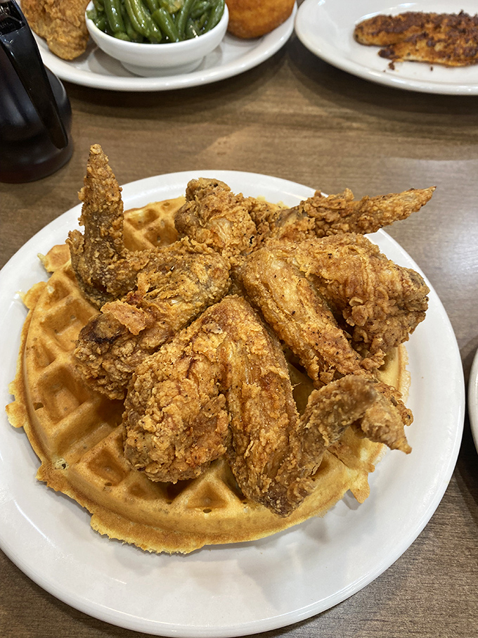 The chicken and waffle alliance—where crispy meets fluffy in a treaty of deliciousness that settles the breakfast-or-lunch debate once and for all.
