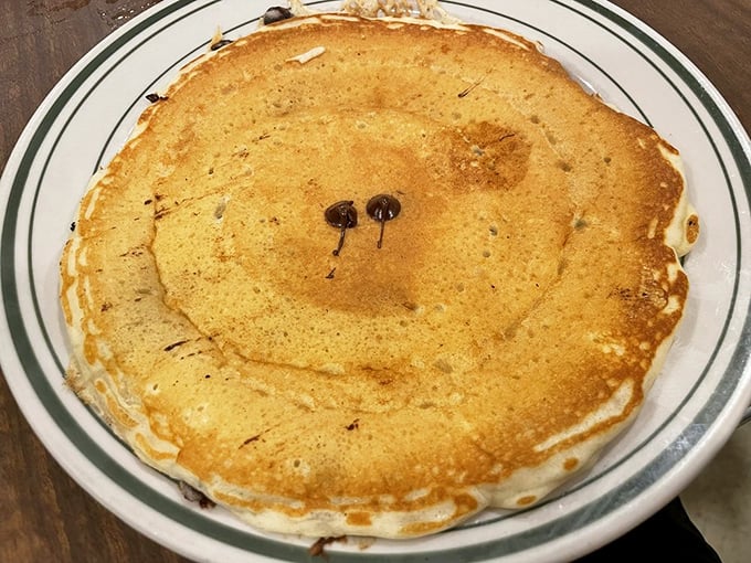 The chocolate chip pancake – childhood joy in adult-sized portions. Those melty chocolate spots are like treasure maps to happiness on your plate.