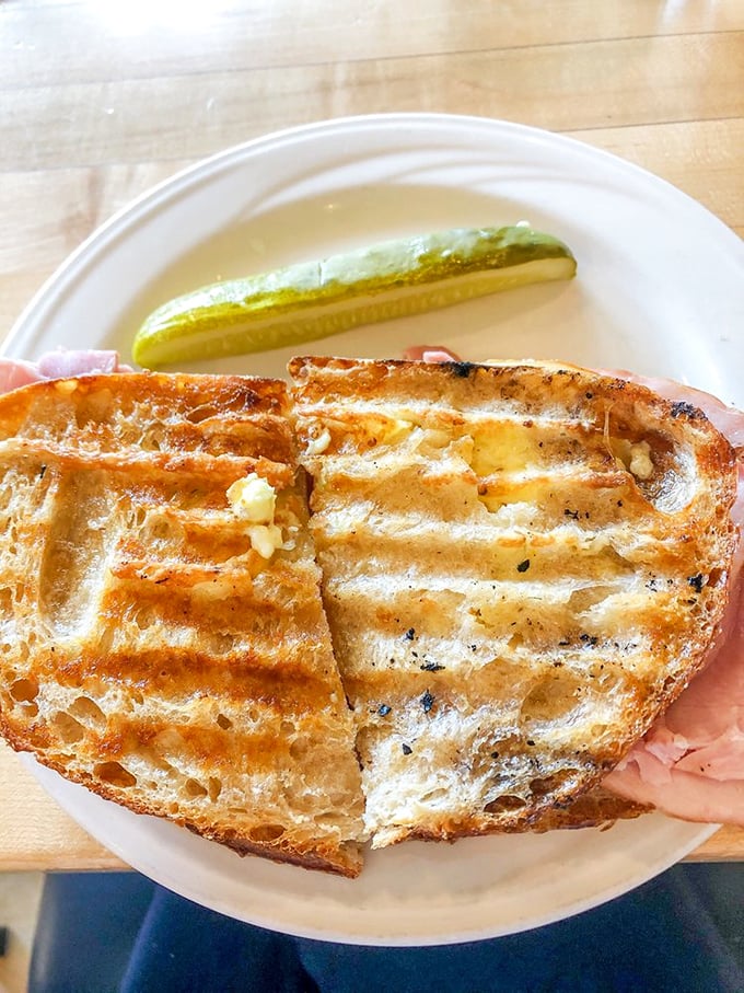 This isn't just a sandwich—it's France on a plate. The golden-brown bread makes an audible "crunch" that turns heads.