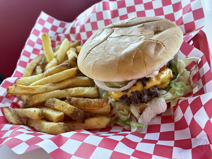 This isn't just a cheeseburger—it's architecture. The golden fries standing at attention nearby know they're in the presence of greatness.