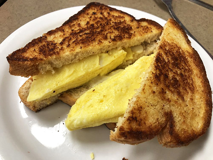 Breakfast simplicity elevated to an art form – this egg sandwich proves that sometimes the classics need no improvement.