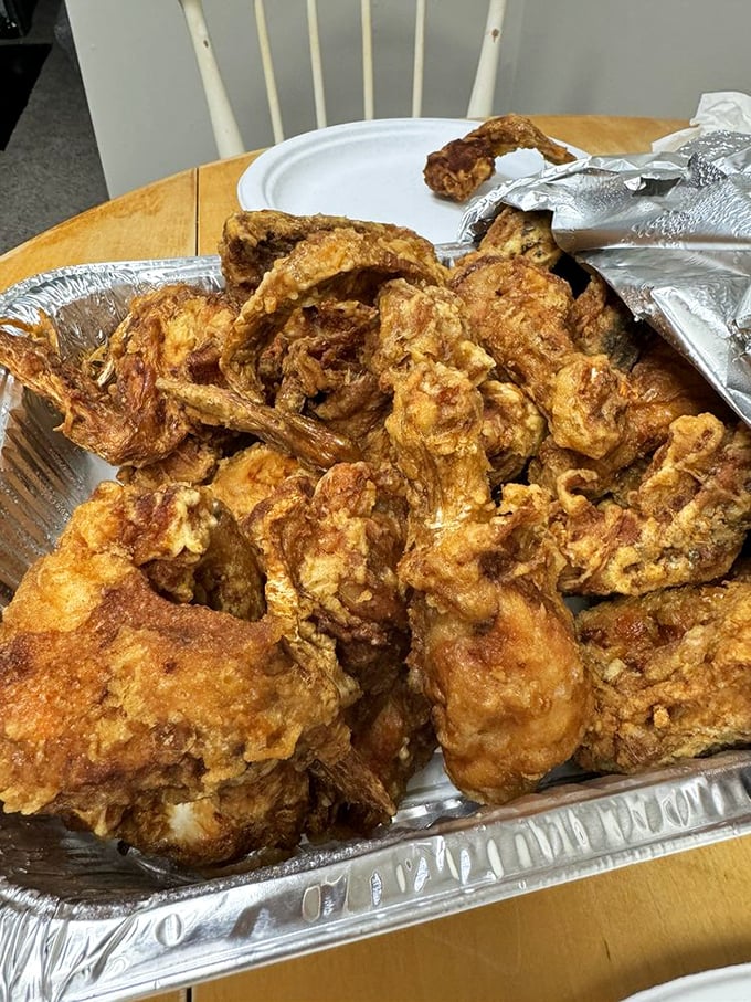 Golden-brown fried chicken that makes you understand why people cross roads, climb mountains, and drive across state lines just for a taste.
