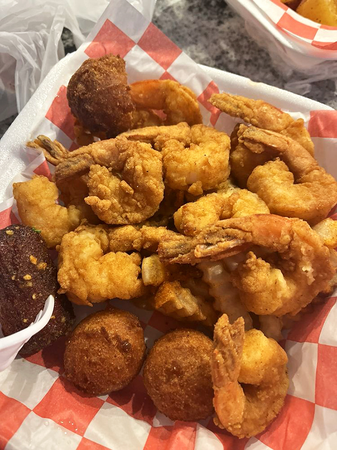 Golden-fried shrimp and hushpuppies – proof that sometimes the simplest preparations create the most profound pleasure.