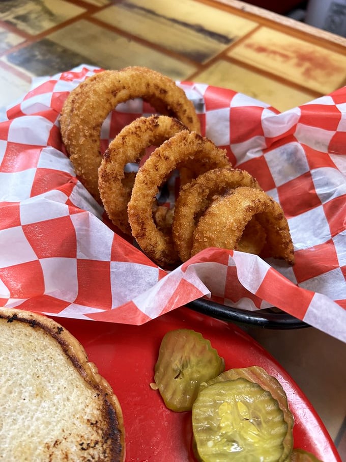Crispy armor protecting sweet, tender onion within. These rings aren't just a side—they're an achievement in the art of simple pleasures.